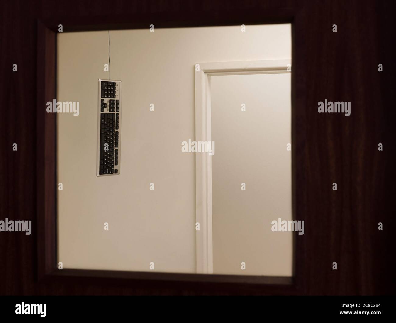 Keyboard hanging from ceiling Stock Photo - Alamy