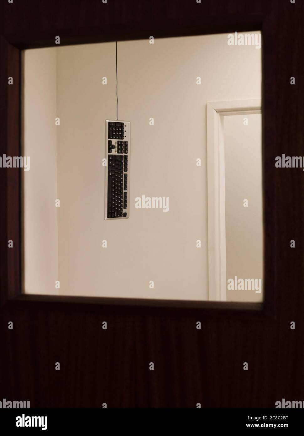 Keyboard hanging from ceiling Stock Photo - Alamy