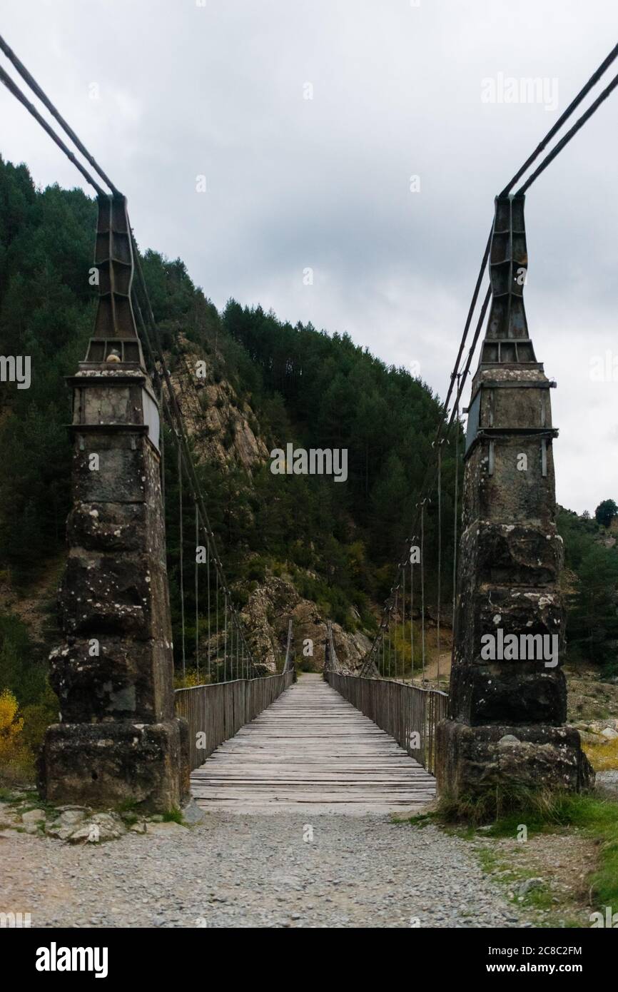 Old long bridge to cross the river Stock Photo - Alamy