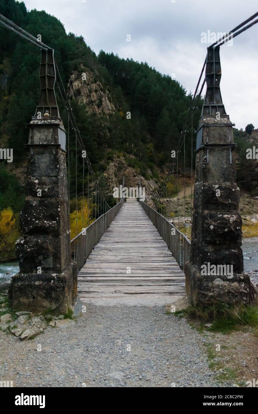 Old long bridge to cross the river Stock Photo - Alamy