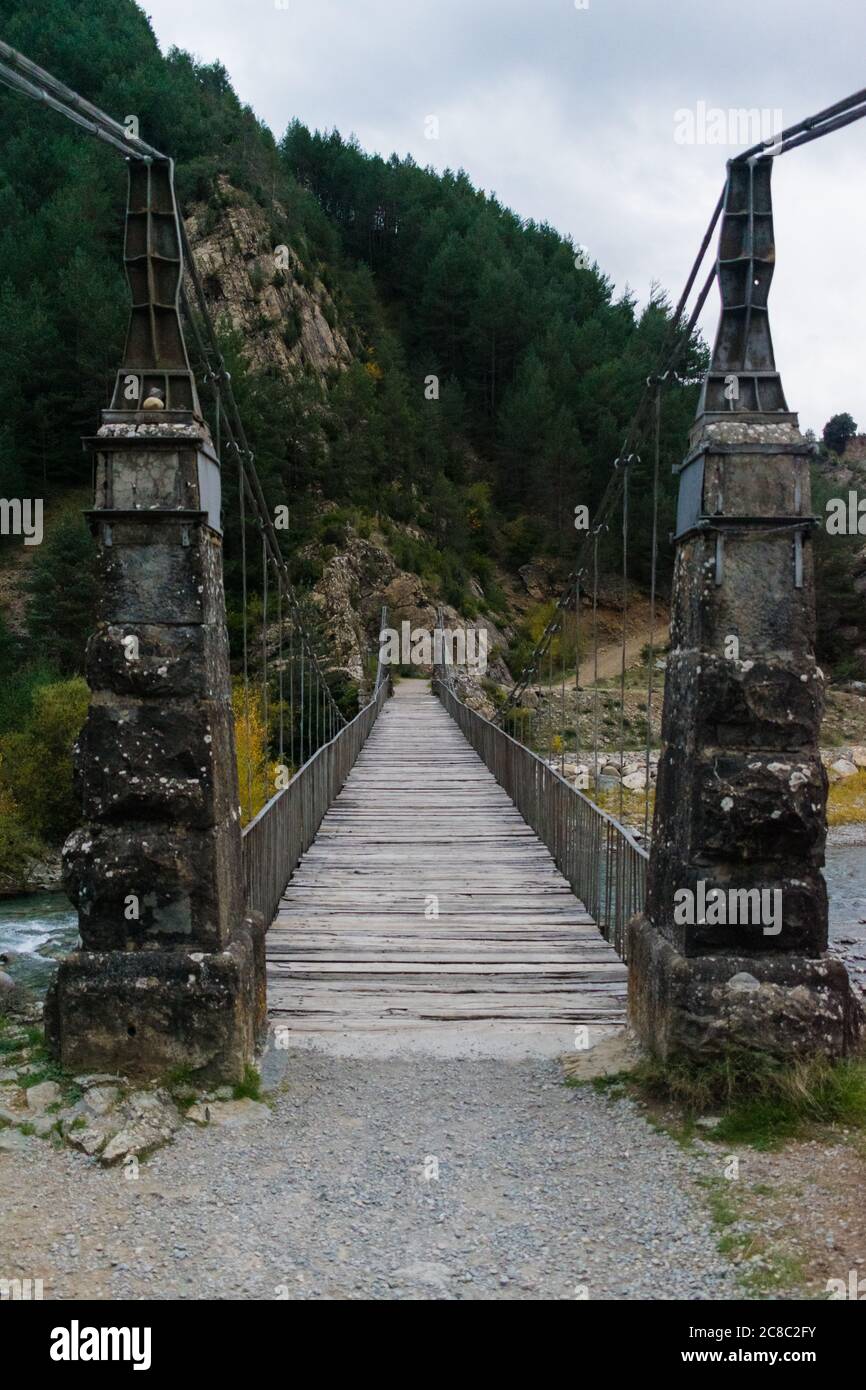 Old long bridge to cross the river Stock Photo - Alamy