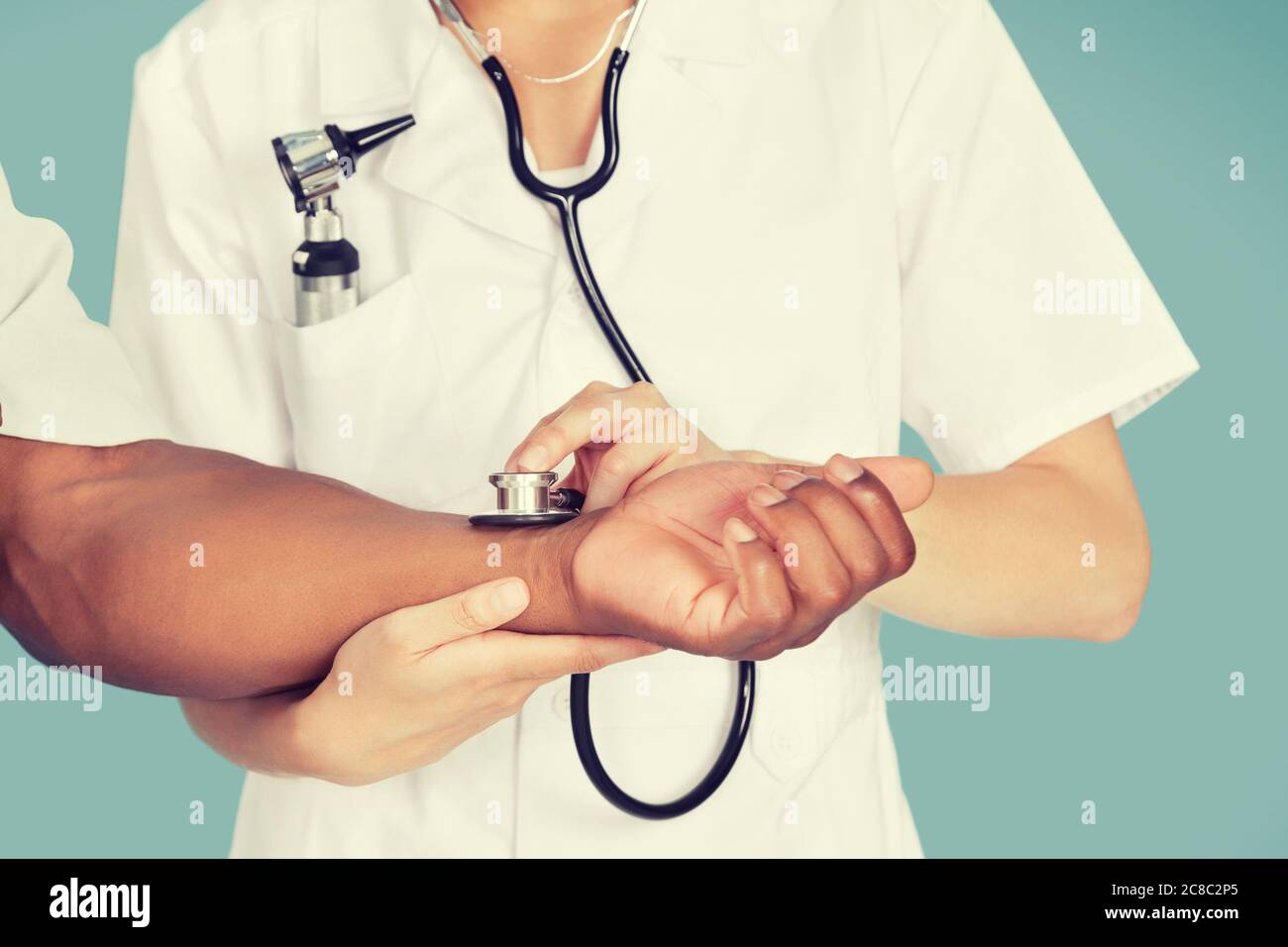 Nurse taking listening to patients heart beat using stethoscope Stock ...
