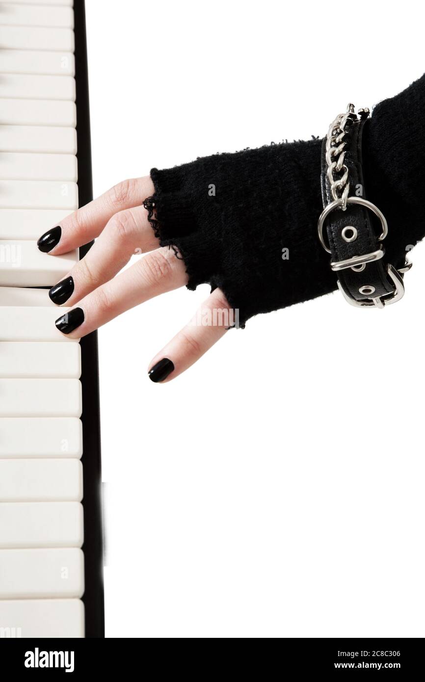 Female goth band playing keyboard piano Stock Photo - Alamy