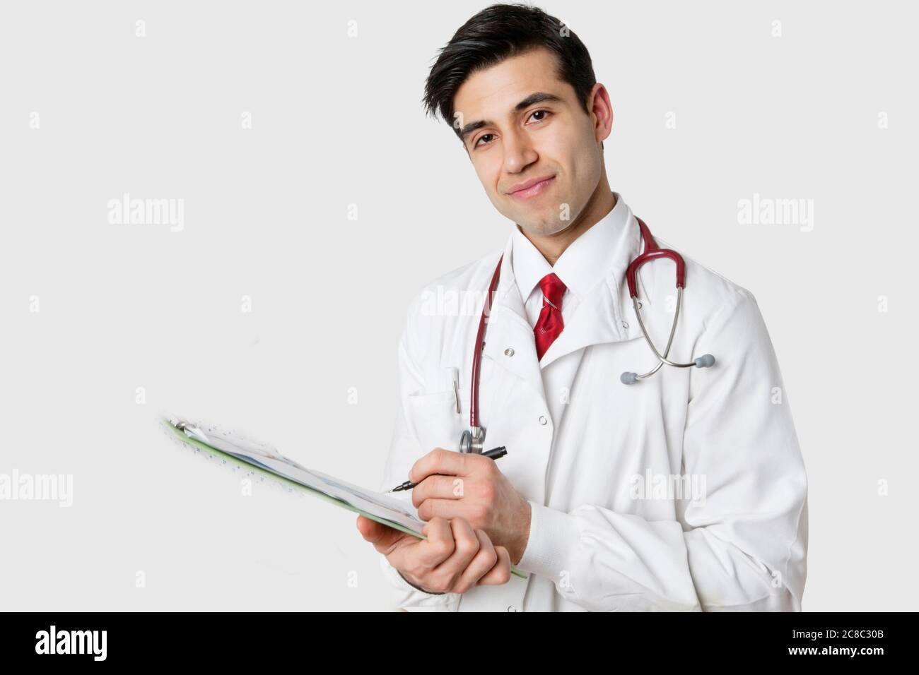Portrait of an Indian doctor writing prescription Stock Photo - Alamy