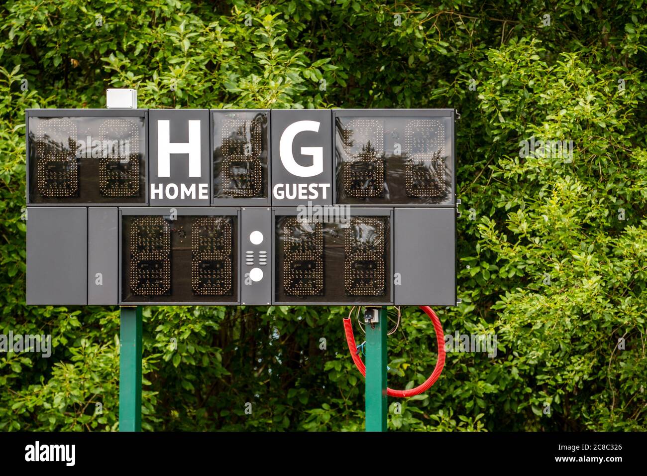 Digital scoreboard with home and guests written on it Stock Photo - Alamy