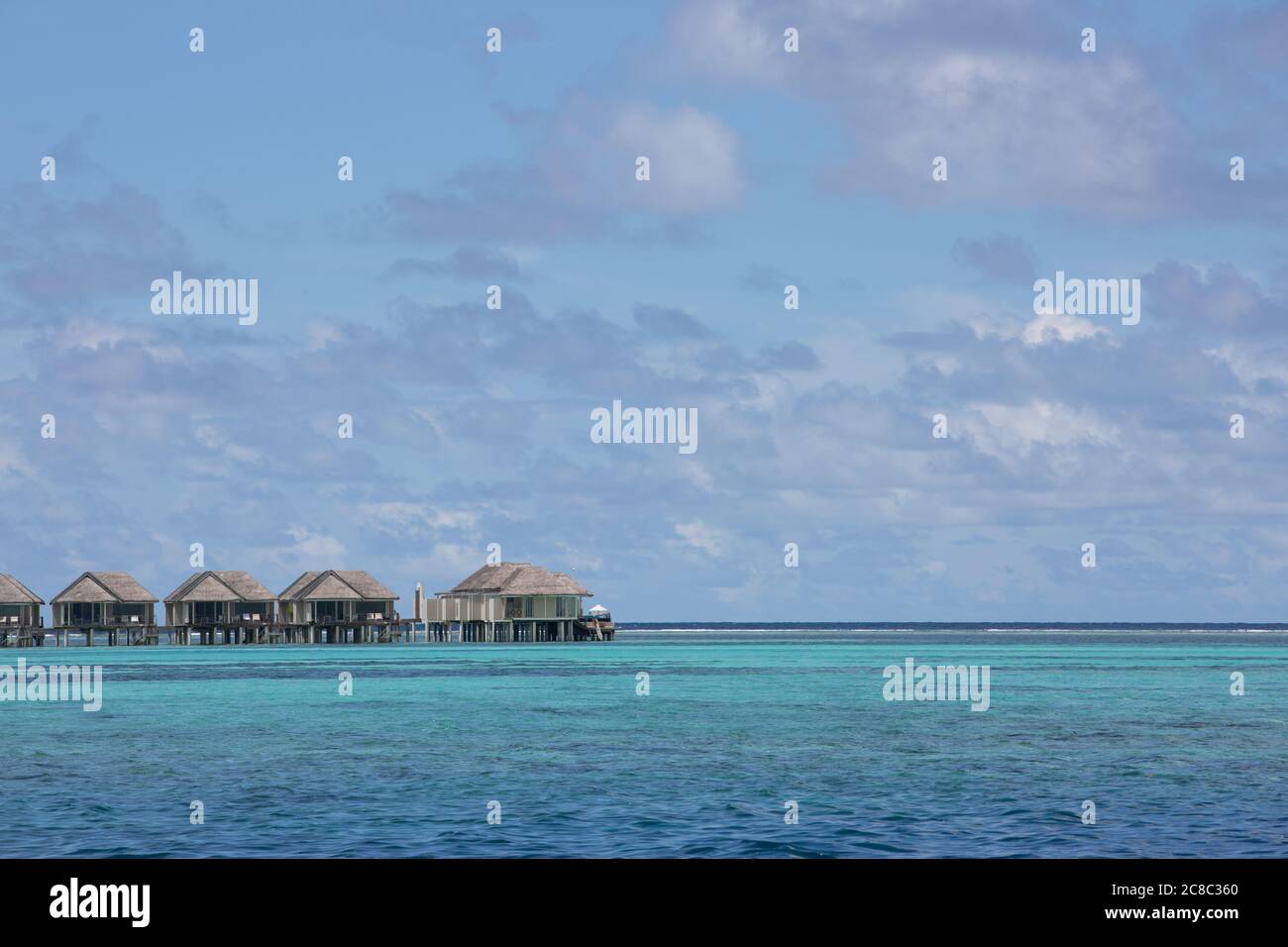 Maldives island, luxury water villas resort and wooden pier. Beautiful ...