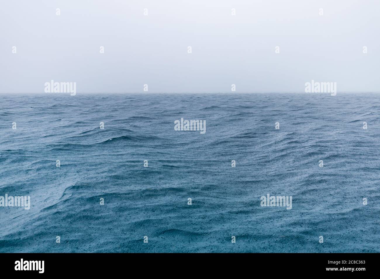 Rain on sea, small waves, ripples. Seascape with endless horizon. Clear ...