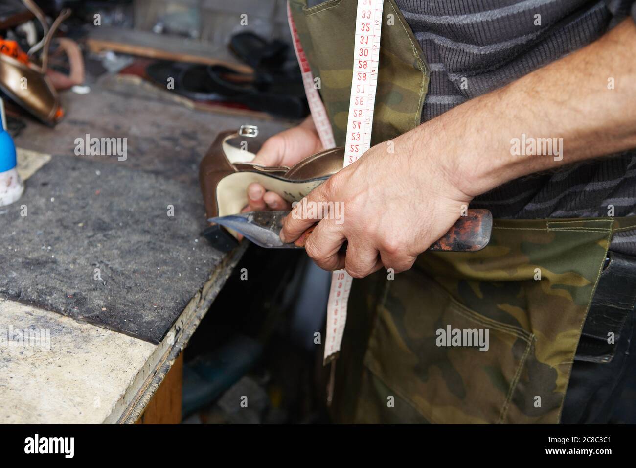Shoemaker Repairing High Heel Shoe Stock Photo - Alamy