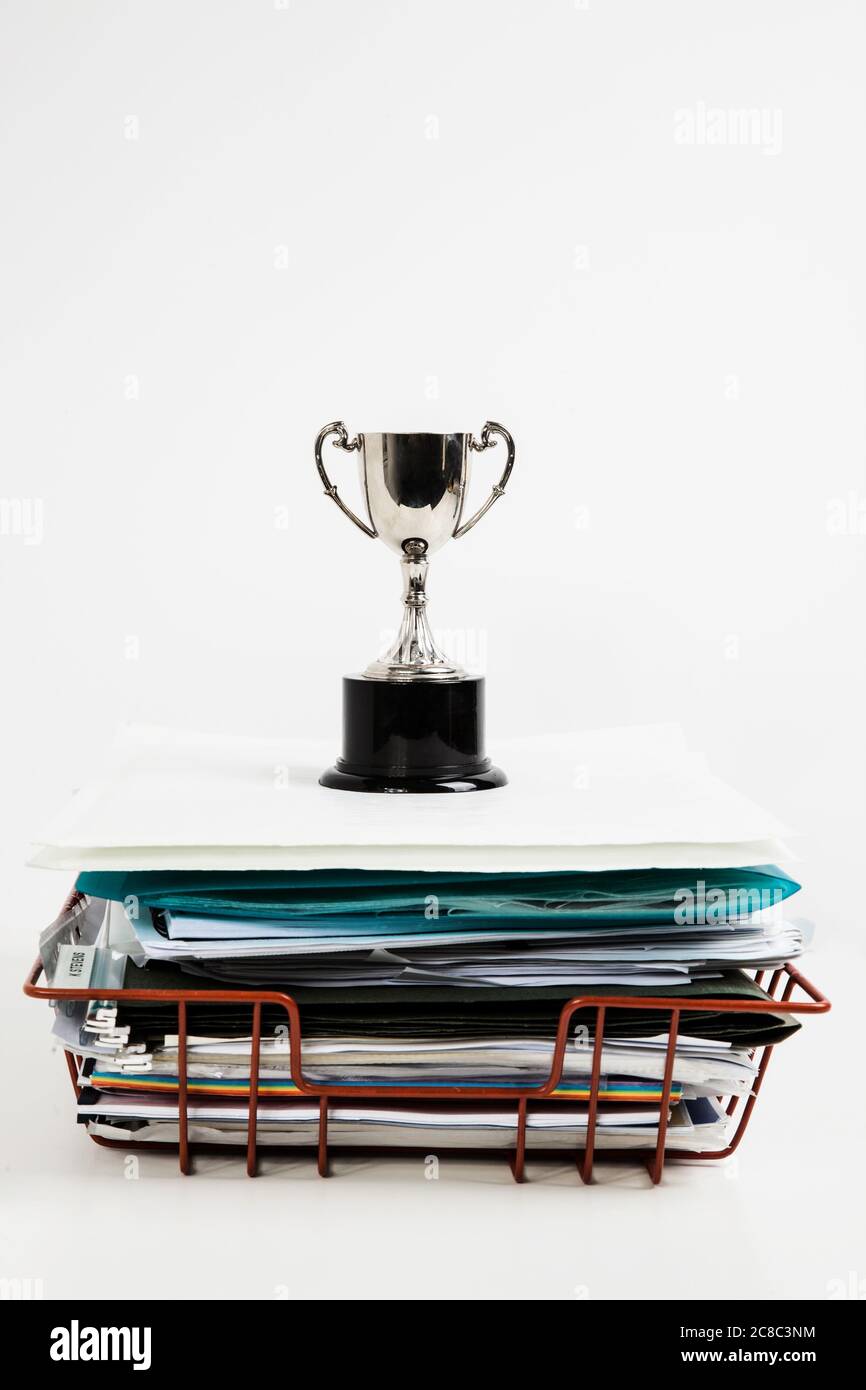 Inbox Tray with trophy Stock Photo - Alamy