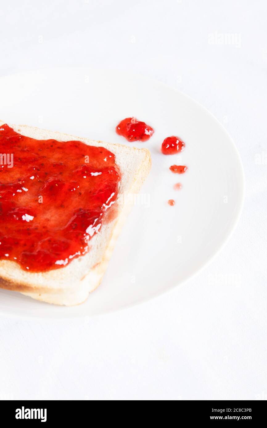 Strawberry jam jelly on toast Stock Photo - Alamy