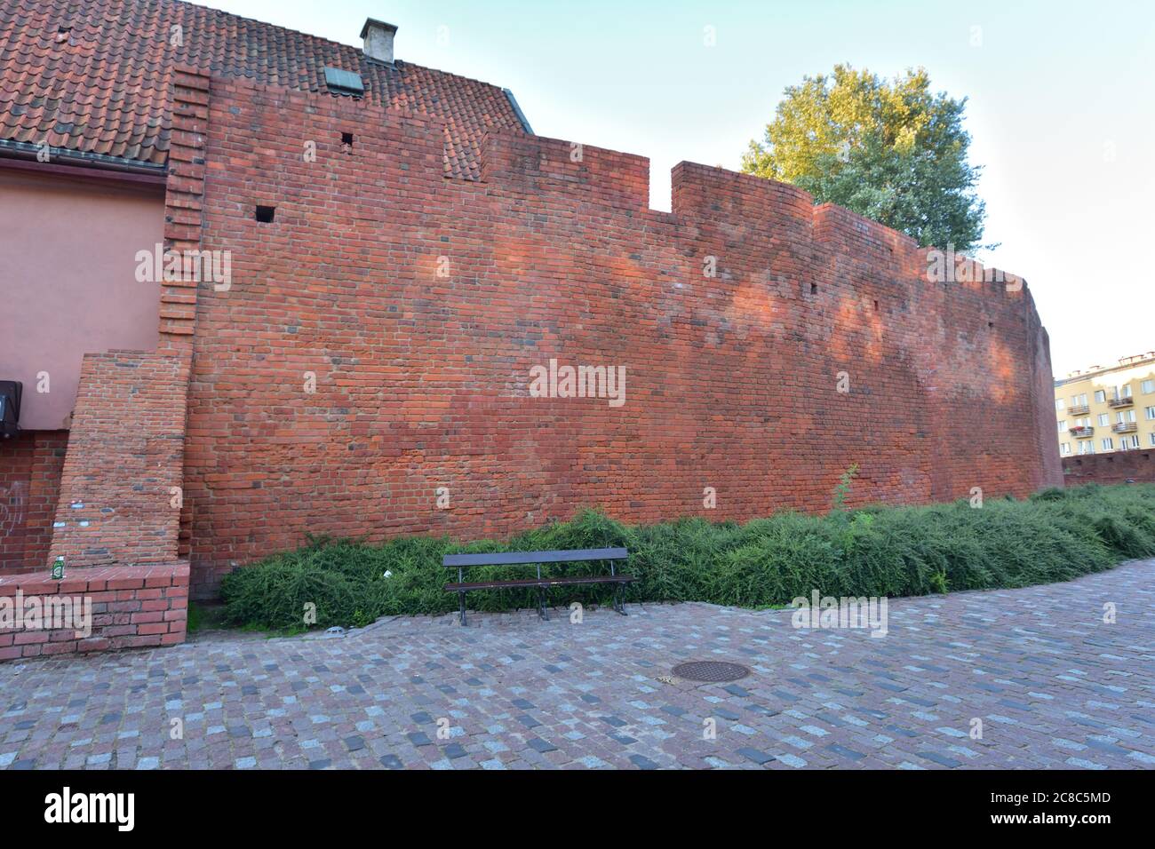 The historic defense walls of the Barbican in Warsaw's Old Town during ...