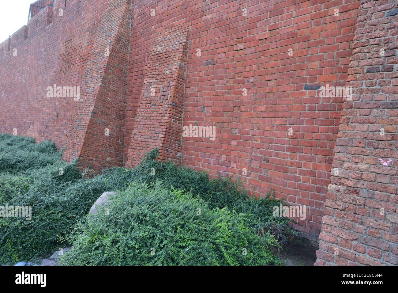 The historic defense walls of the Barbican in Warsaw's Old Town during ...