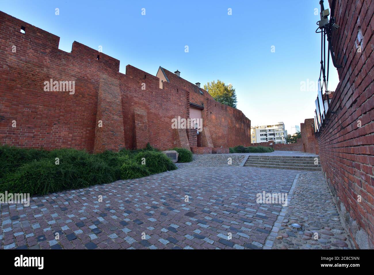 The historic defense walls of the Barbican in Warsaw's Old Town during ...