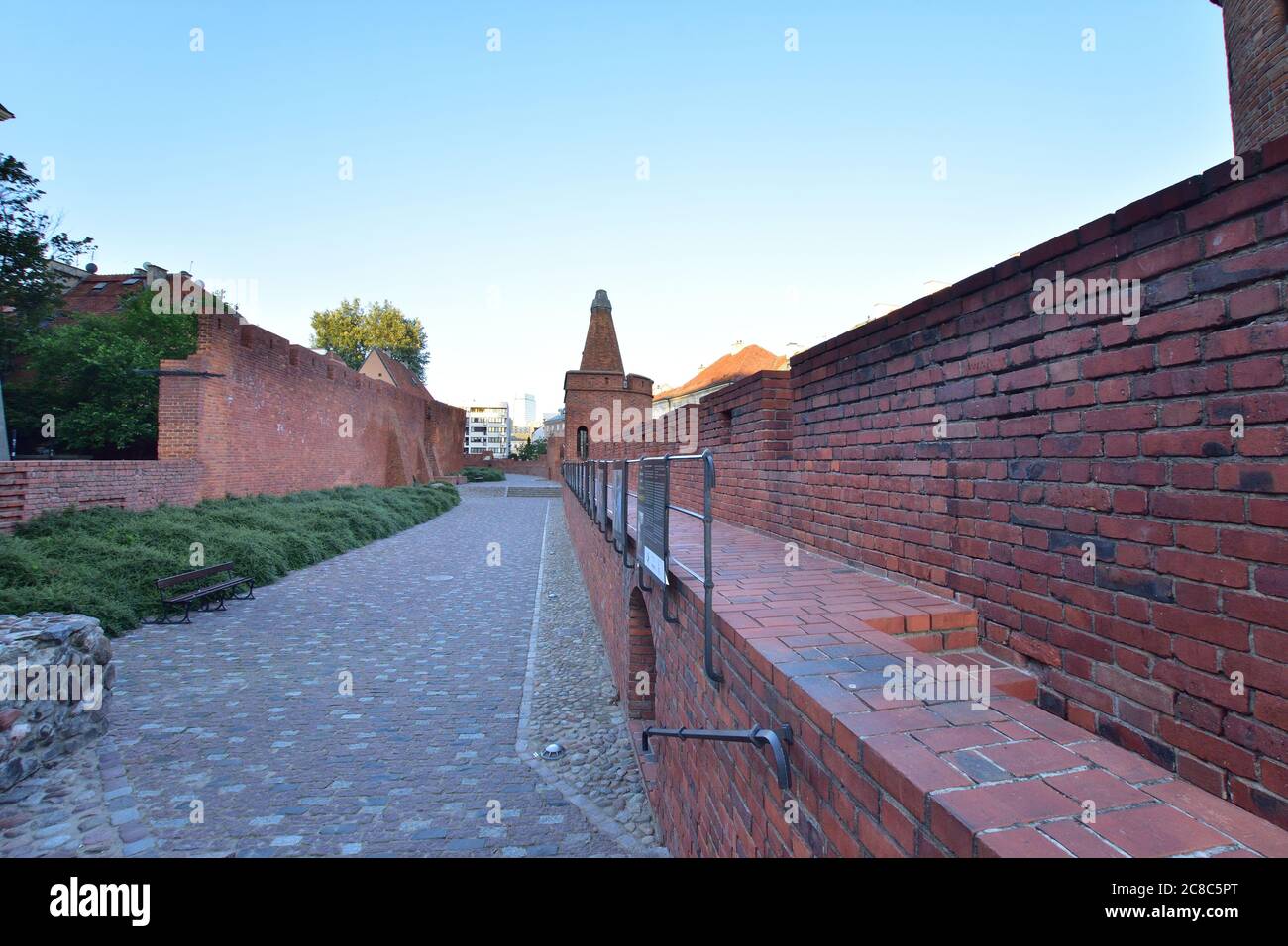 The historic defense walls of the Barbican in Warsaw's Old Town during ...