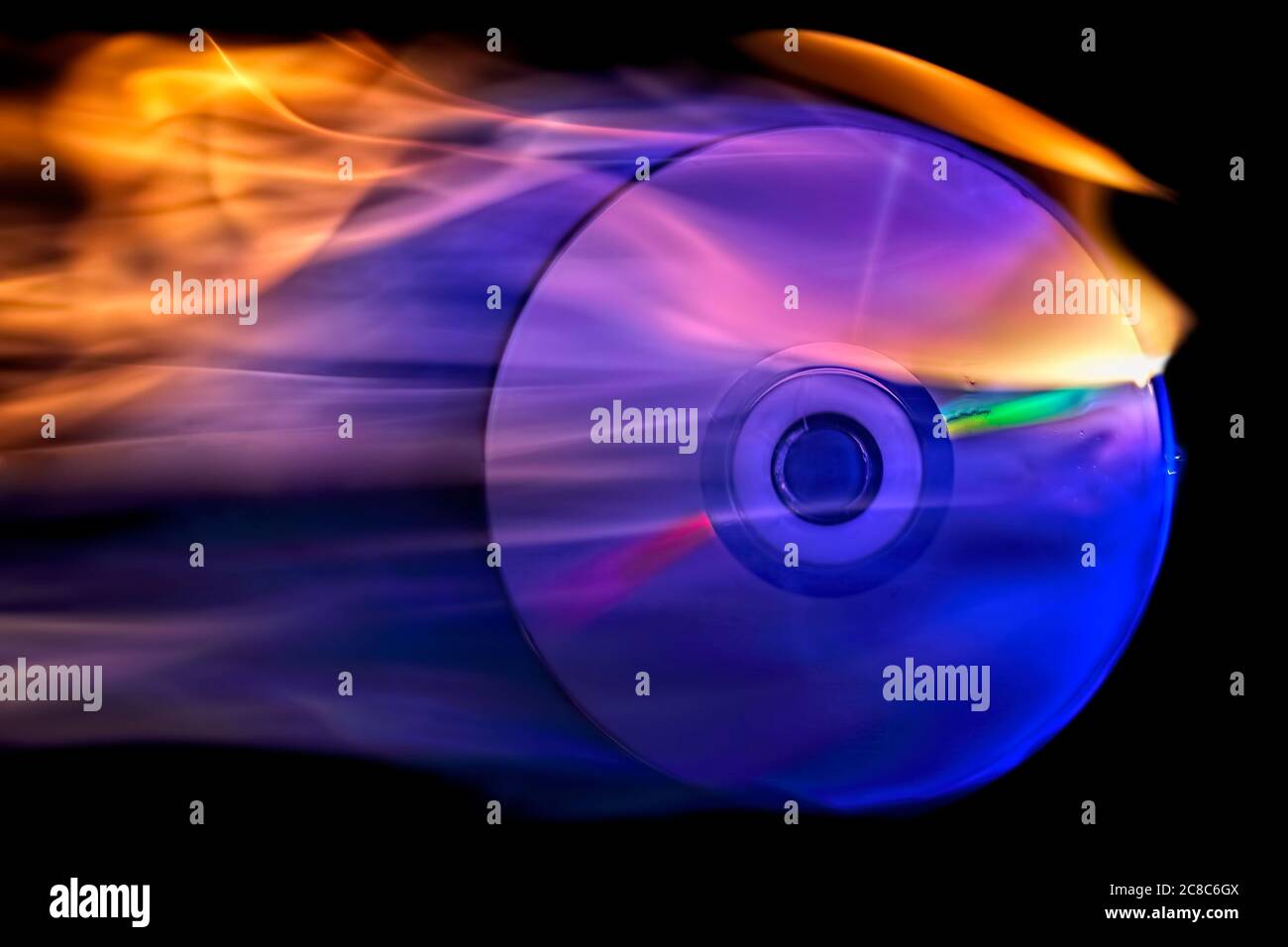 cd is on fire against black background Stock Photo - Alamy