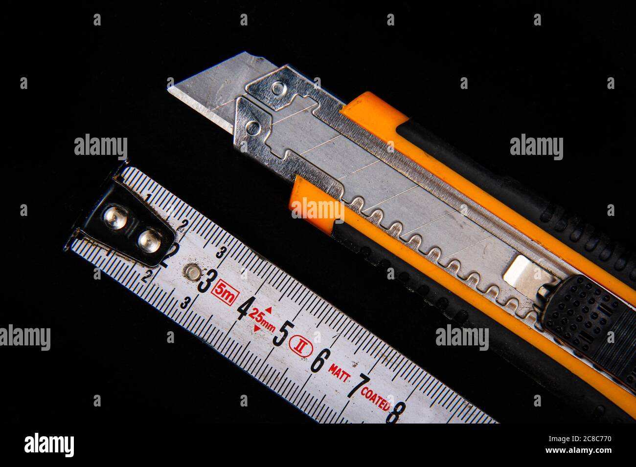 Tape measure and cutter Stock Photo - Alamy
