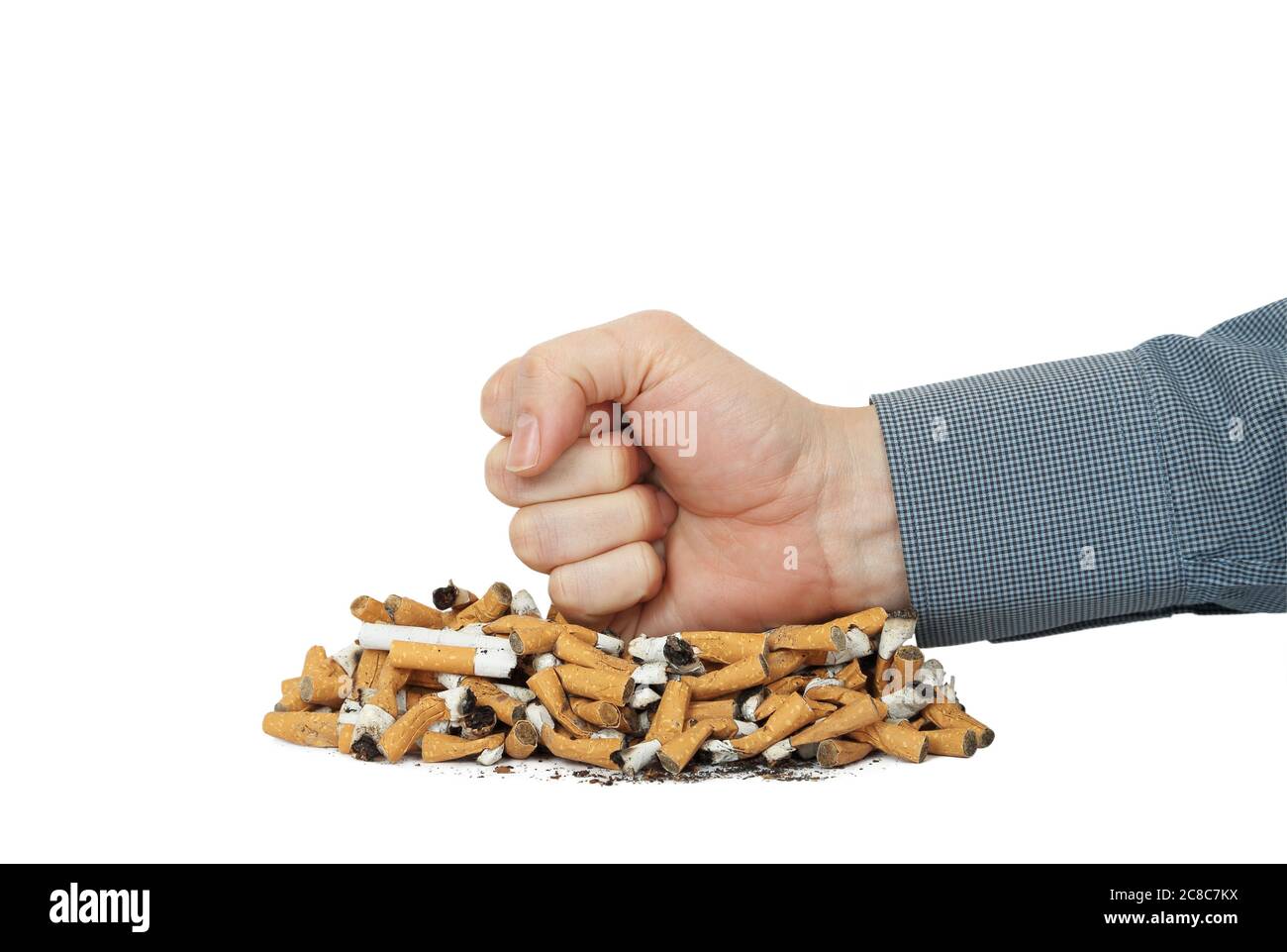 smoker's fist on heap of cigarettes Stock Photo - Alamy