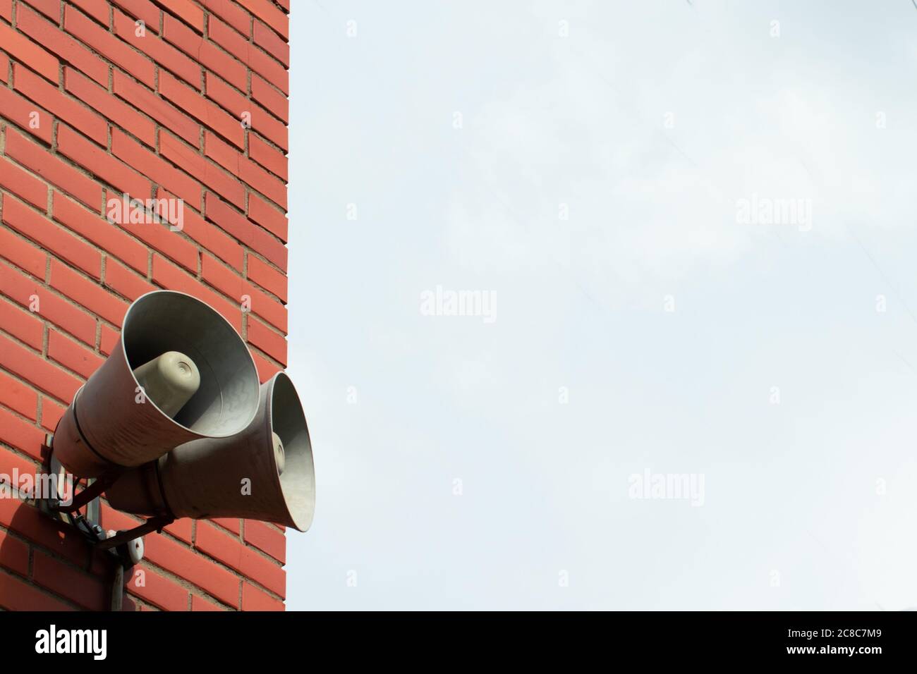 Megaphone on a building on the street. Copy space. Concept of media ...