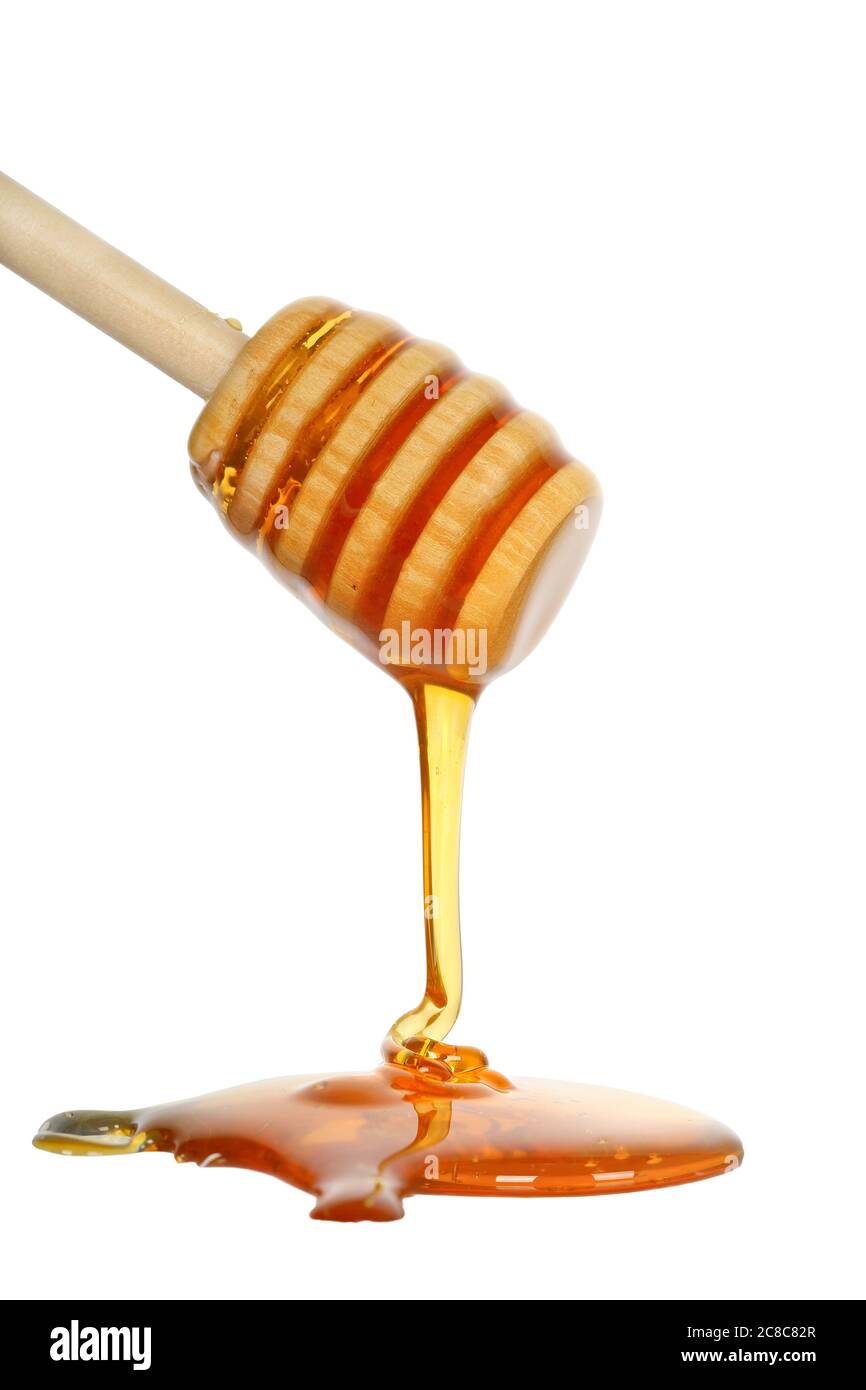 honey dipper with honey on white Stock Photo - Alamy