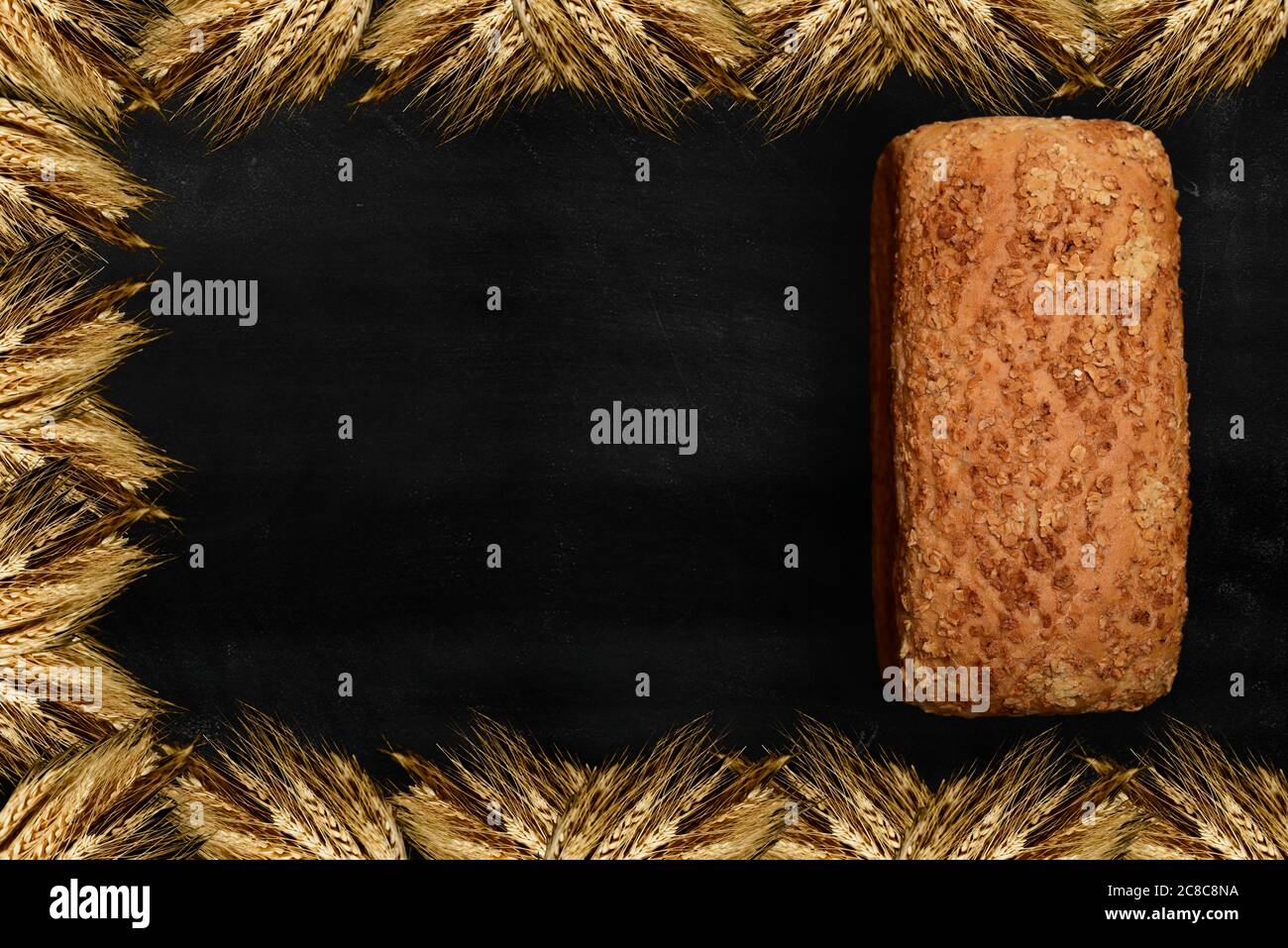 testy wheat bread rusty background with space for text Stock Photo - Alamy