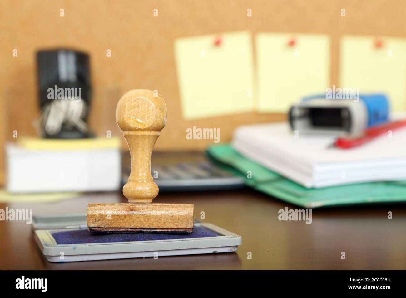 office stamp in front of office items Stock Photo - Alamy