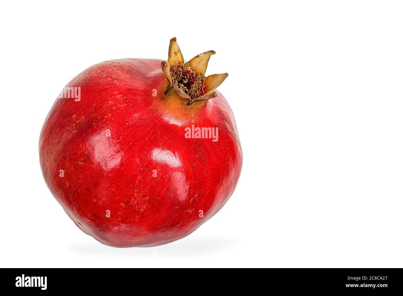 single pomegranate isolated on white Stock Photo - Alamy