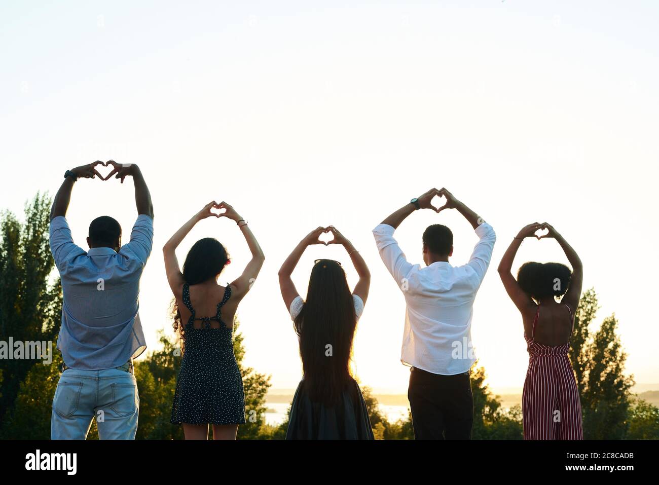 Group of people making heart symbol hi-res stock photography and images ...