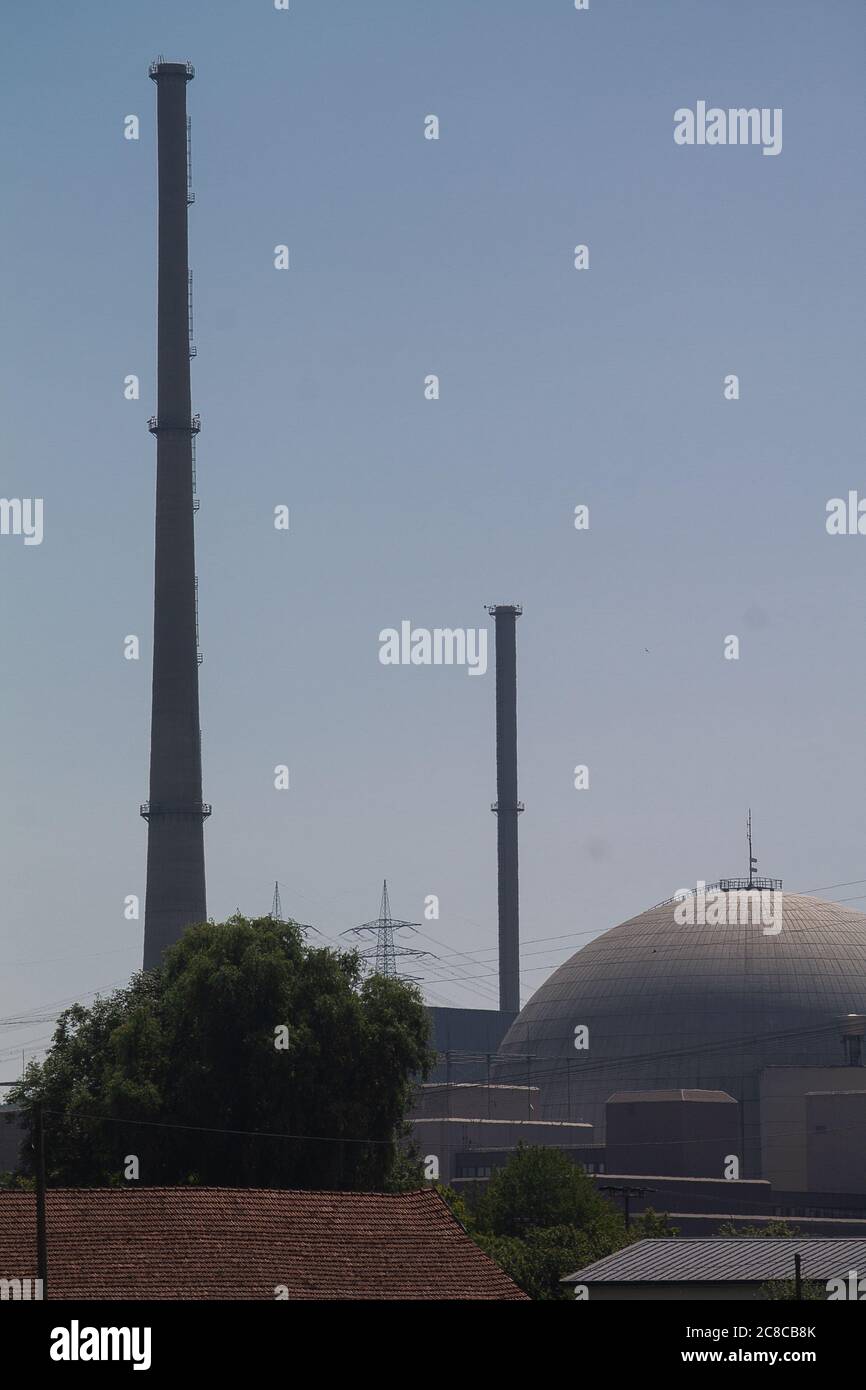 The reactor dome of a nuclear power plant. And behind it two chimneys ...