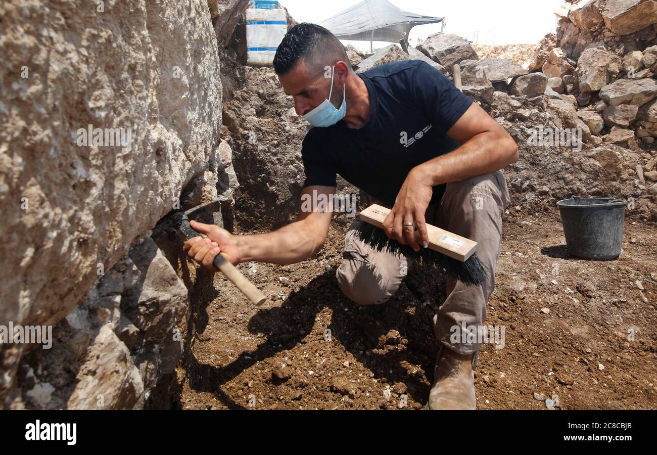 Jerusalem. 22nd July, 2020. An archeologist works at an excavation site ...