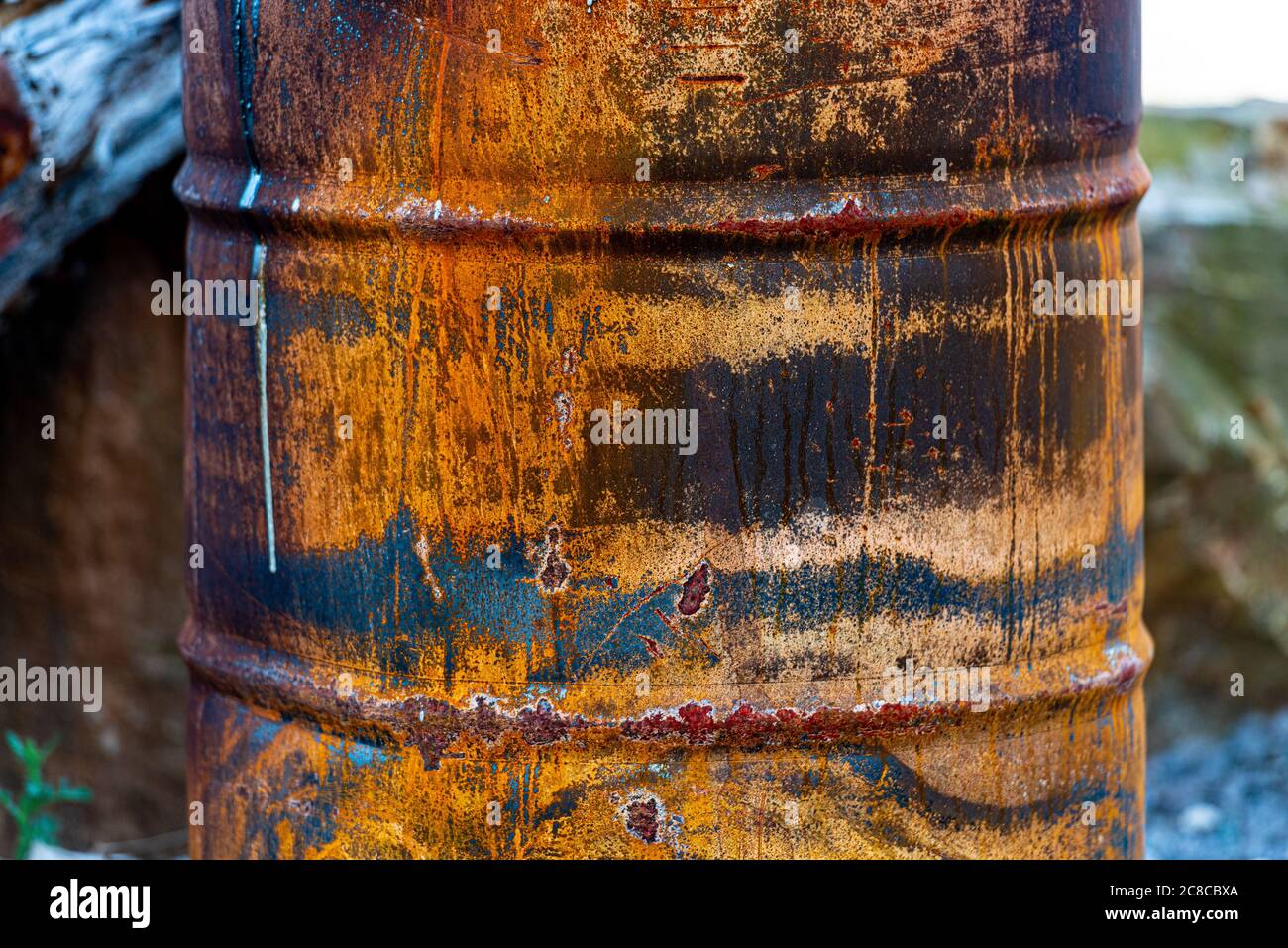 Oxidiced side of a burnt out metal barrel Stock Photo - Alamy