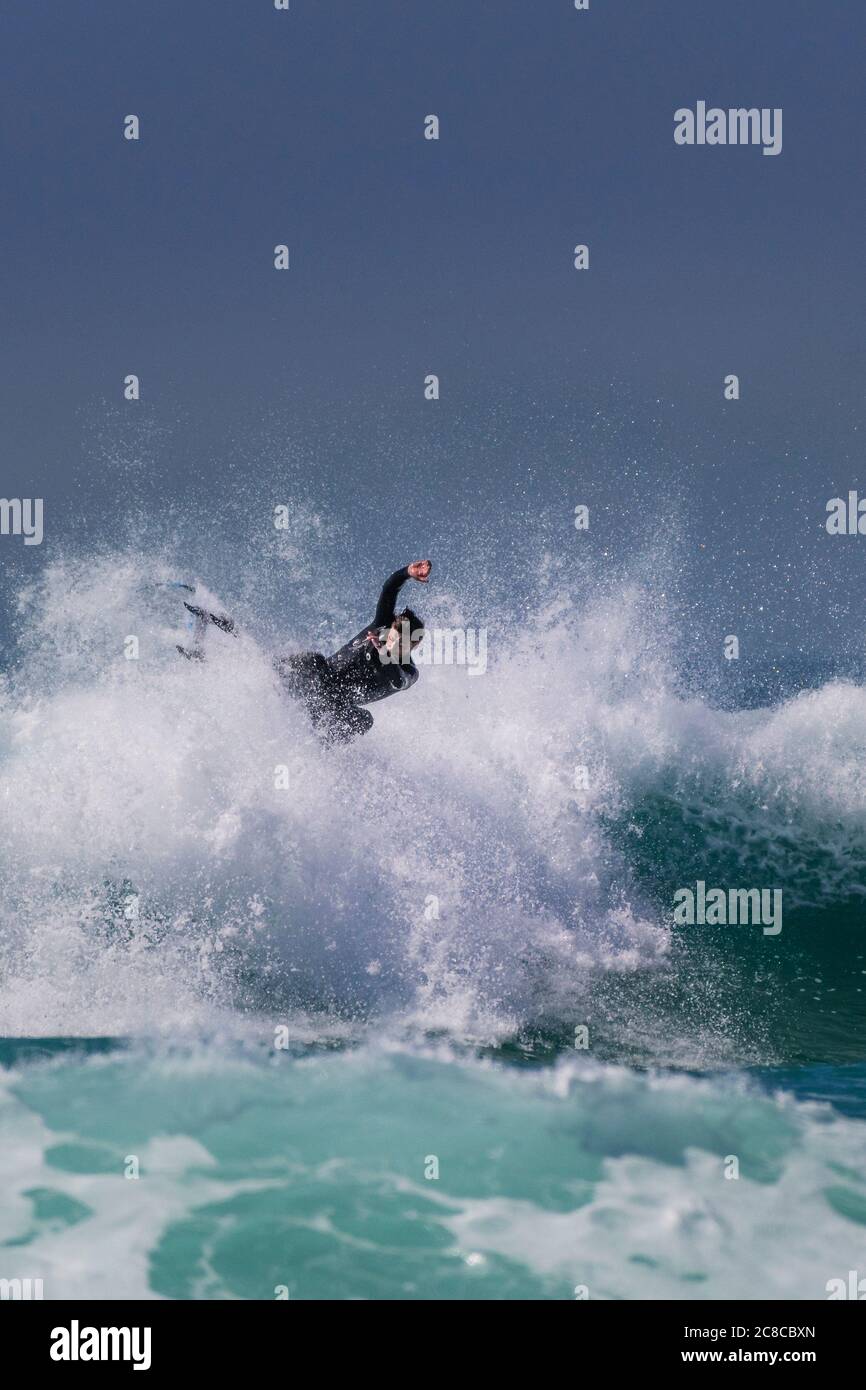 Spectacular surfing action as a surfer rides a wave at Fistral in ...
