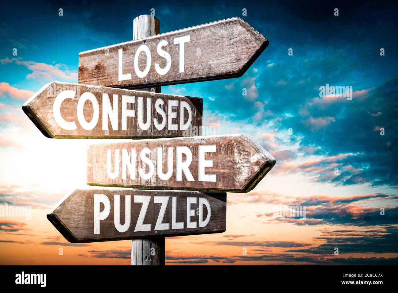 Lost, confused, unsure, puzzled - wooden signpost, roadsign with four ...