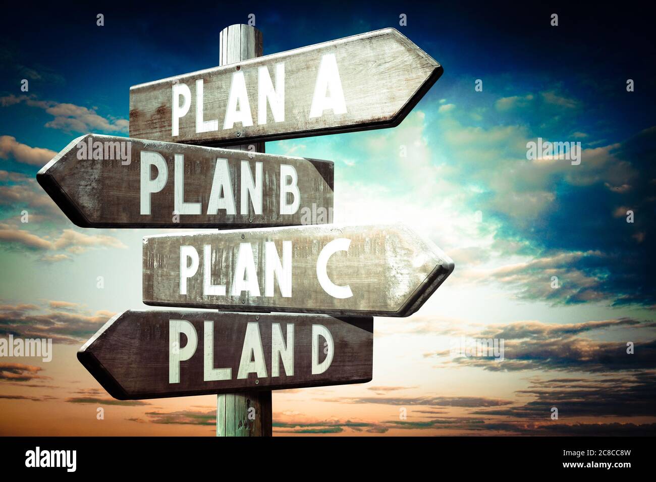 Plan A, B, C, D - wooden signpost, roadsign with four arrows Stock ...