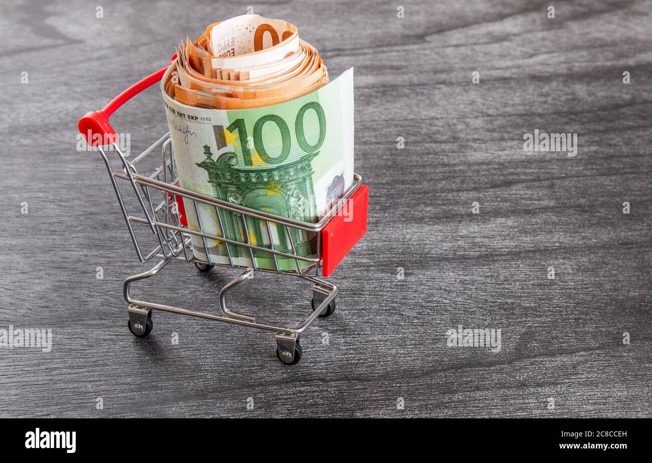Shopping Cart Full of Cash. Shopping consept, euro money in cart ...