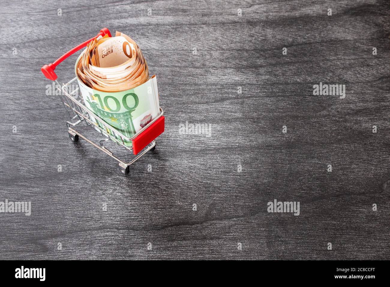 Shopping Cart Full of Cash. Shopping consept, euro money in cart ...