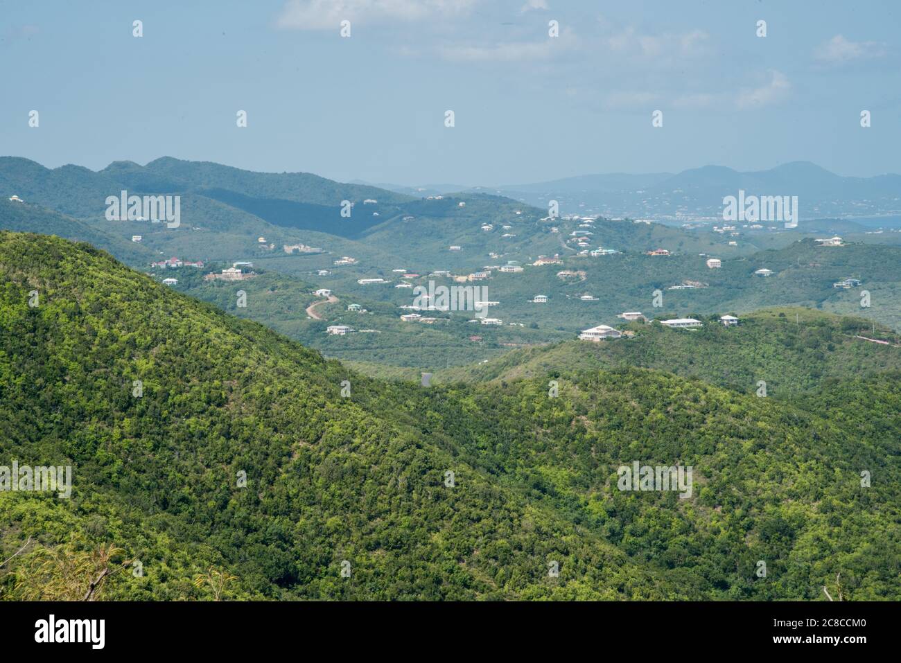Rolling Hill landscape of St. Croix with residential housing with ...