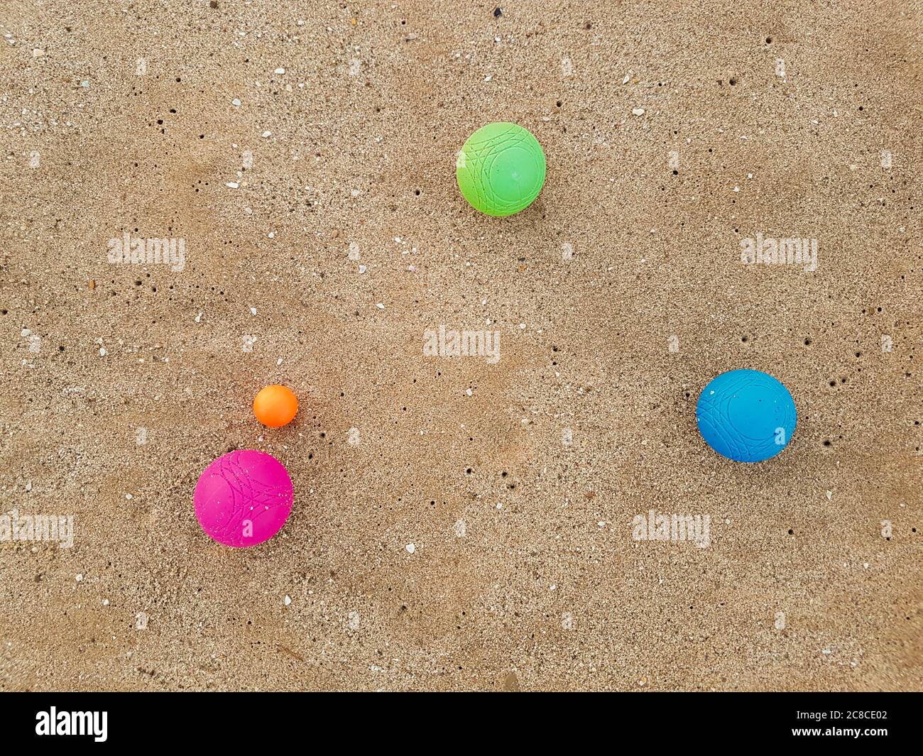 Closeup of colorful beach balls on the sand at the beach Stock Photo ...