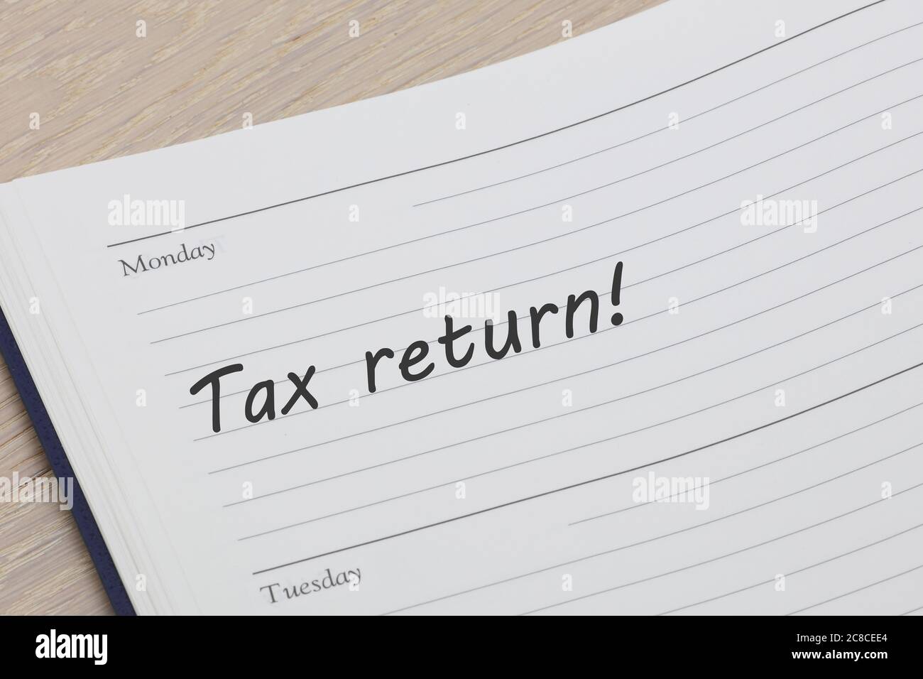 tax return diary reminder open on desk Stock Photo - Alamy