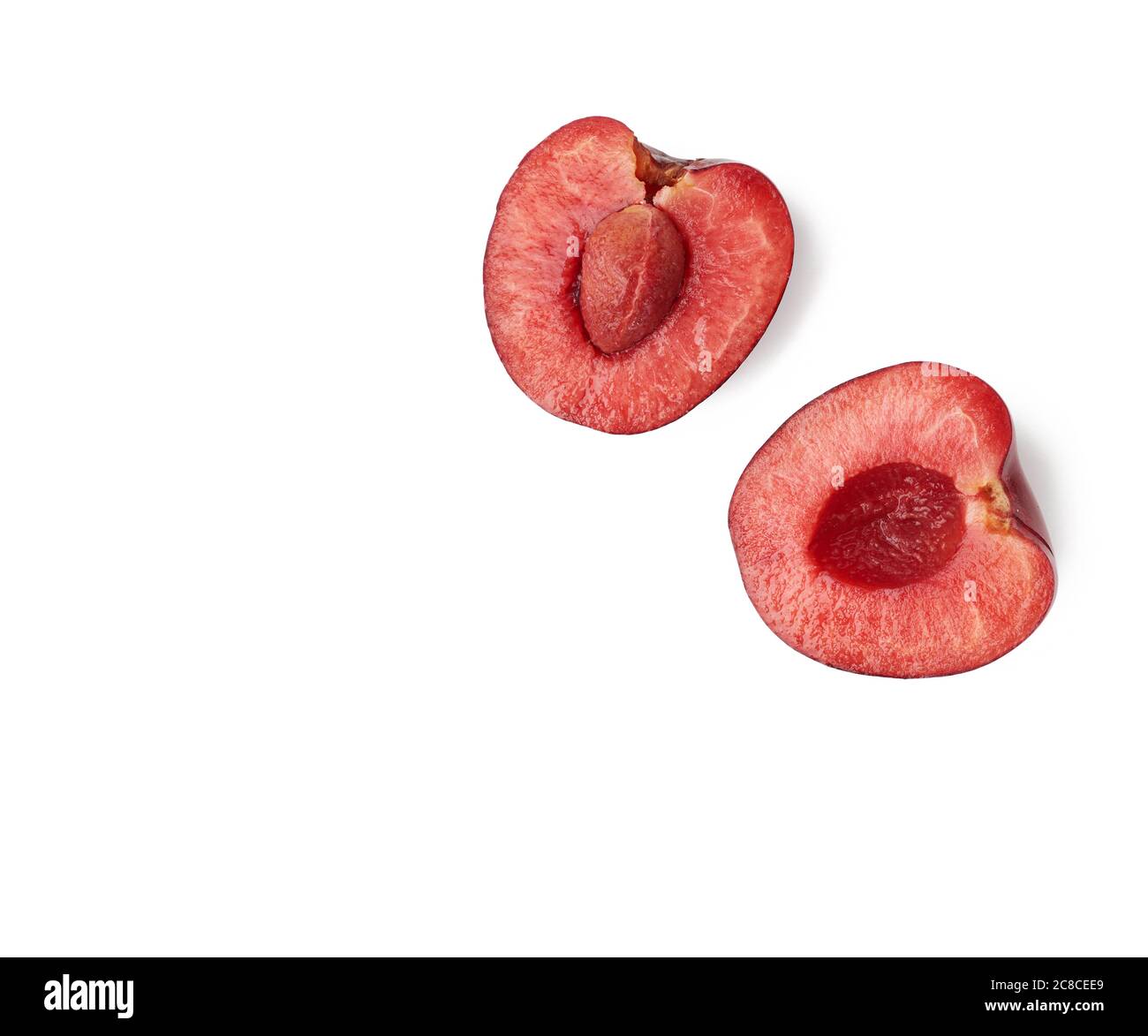 half ripe red sweet cherry with pit isolated on white background, macro ...