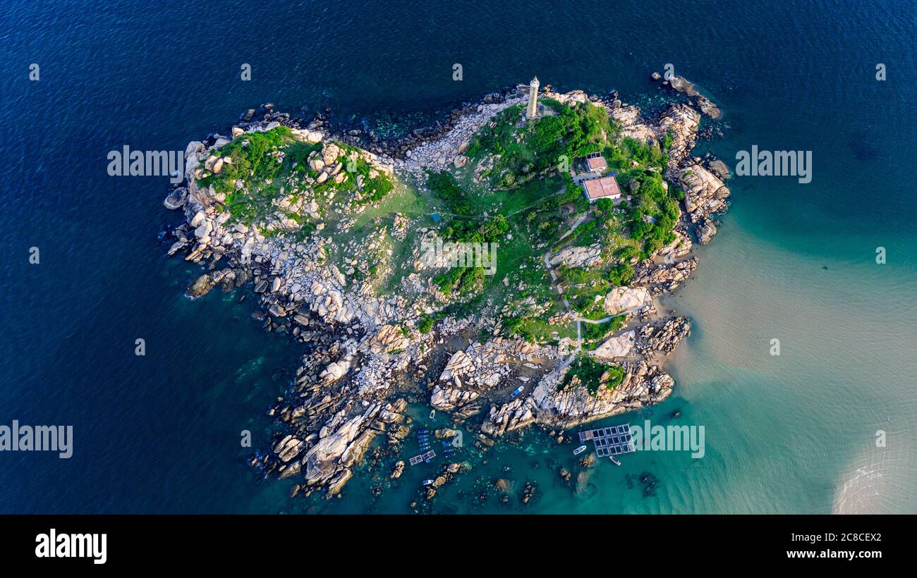 Ke Ga lighthouse on heart shaped island in Vietnam. Drone aerial photo ...