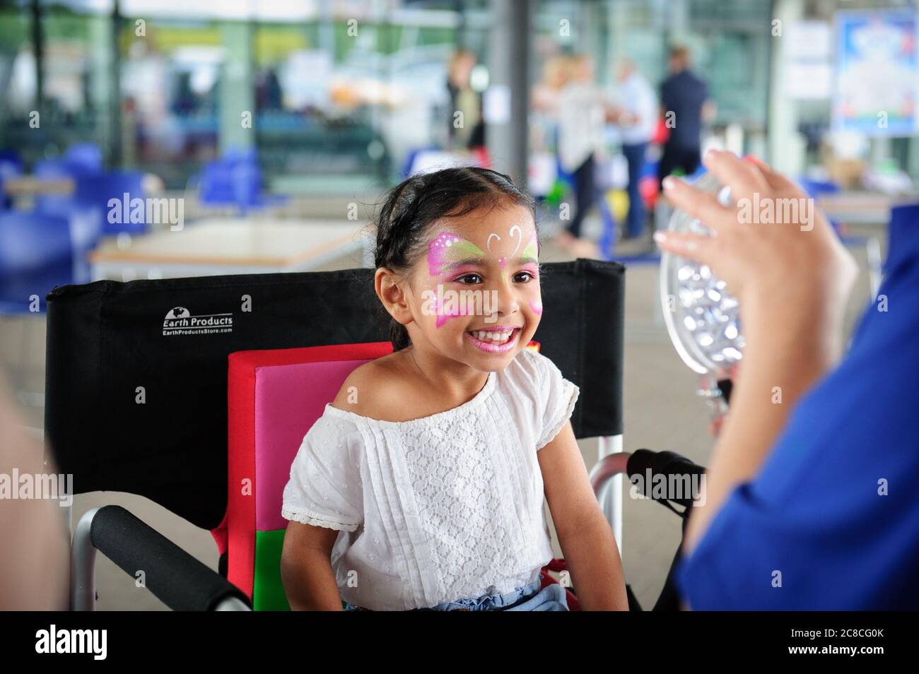 Face painting children at a family fun day. Face paint fun and many ...