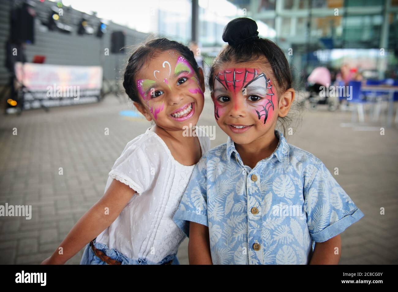 Face painting children at a family fun day. Face paint fun and many ...