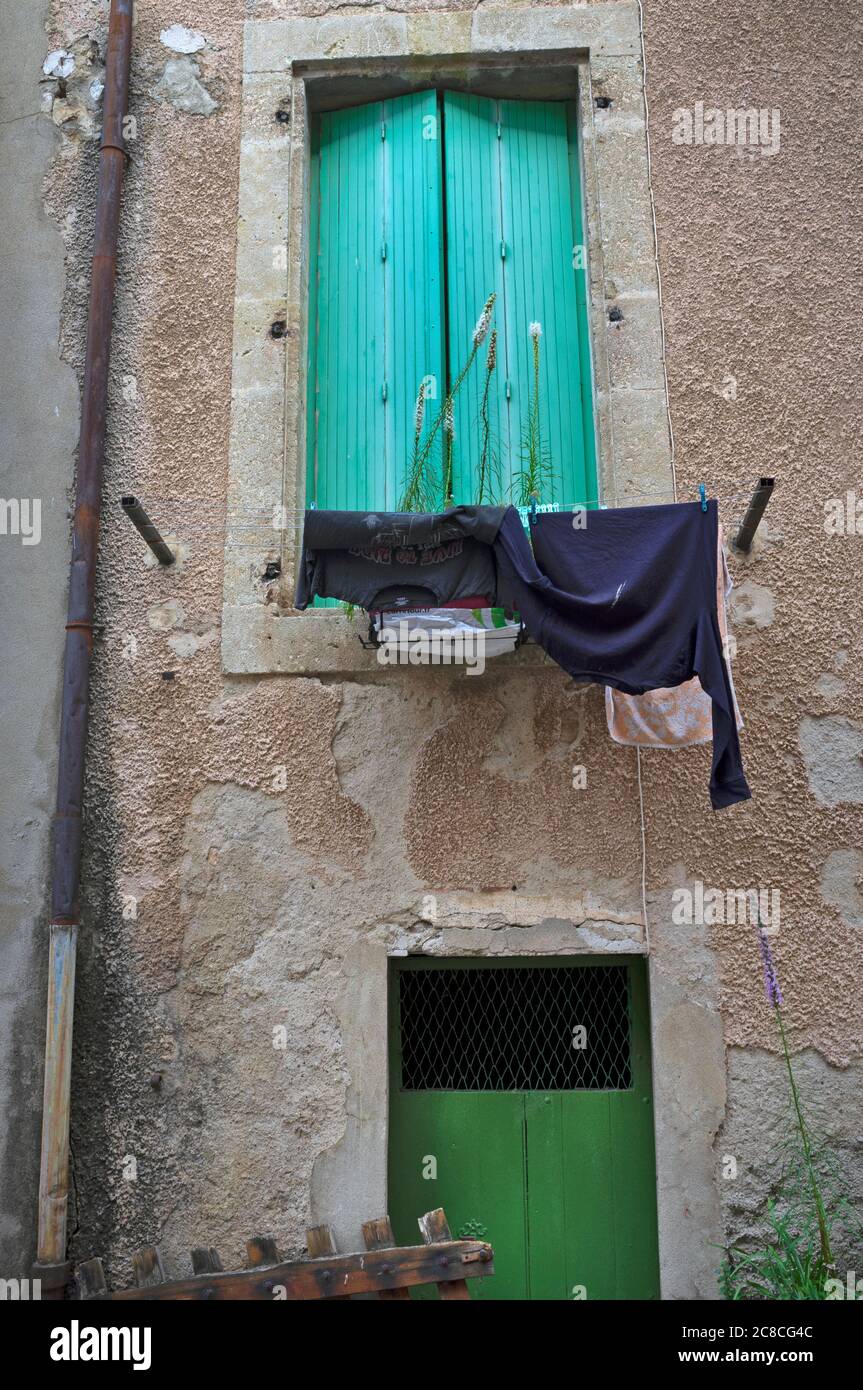 Clothes drying on a washing line in the pretty French village of ...