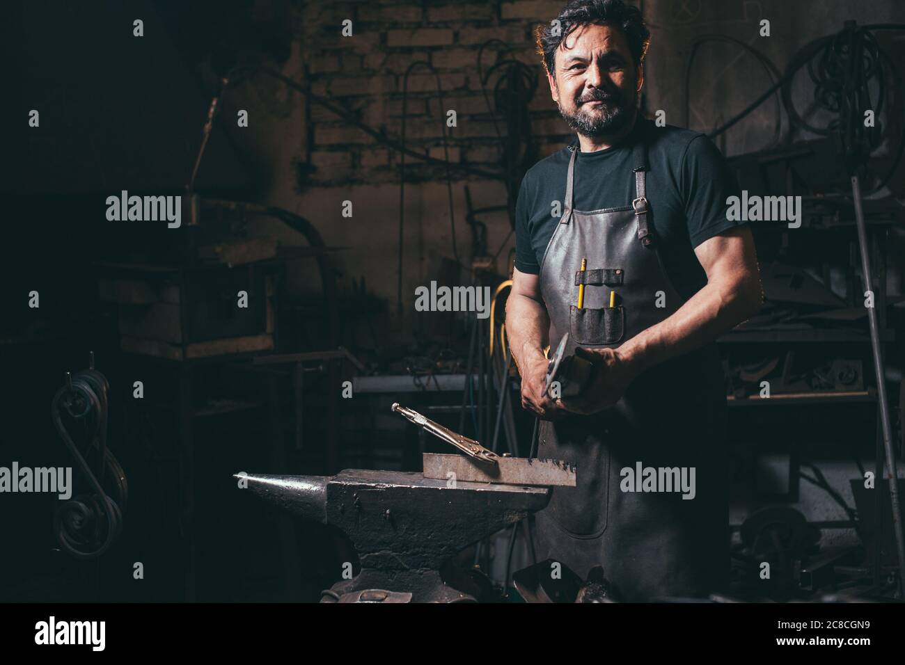 Worker Using Angle Grinder in Factory and throwing sparks Stock Photo ...