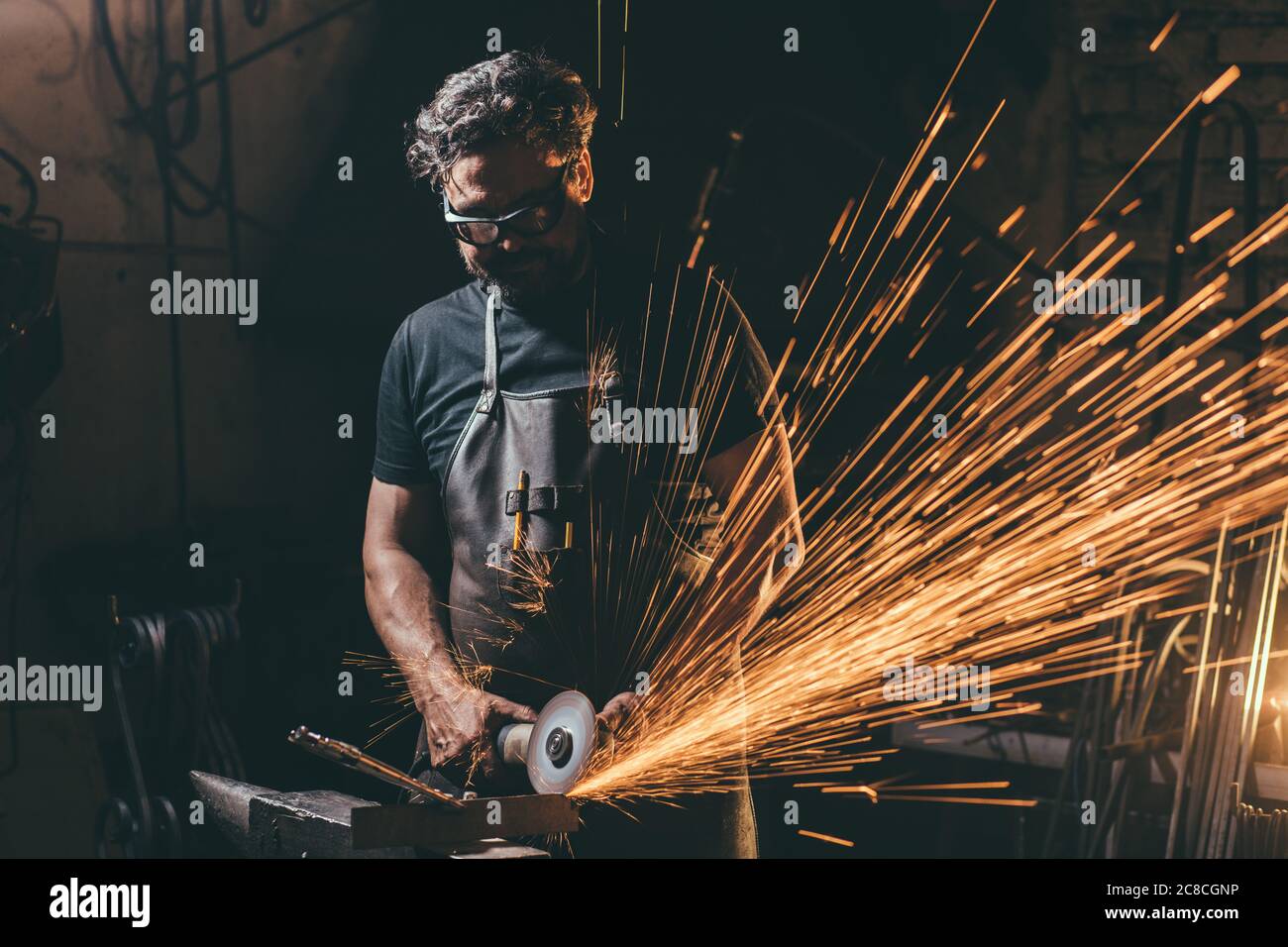 bearded man using angle grinder blow sparks Stock Photo - Alamy