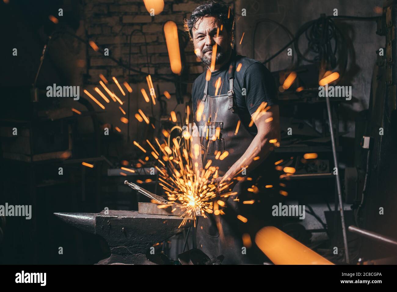 man using angle grinder sparks in camera Stock Photo - Alamy