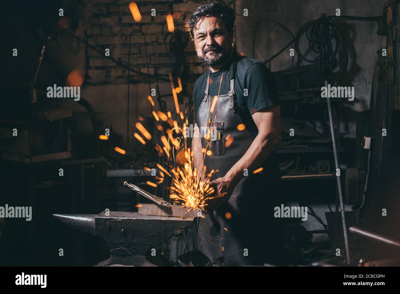 Worker Using Angle Grinder in Factory and throwing sparks in camera ...