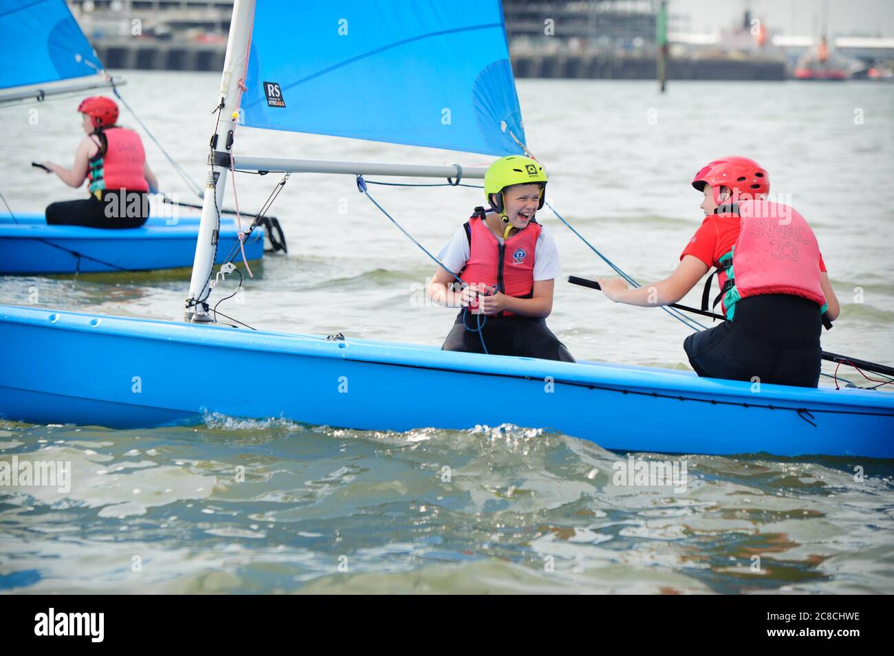 Kids sailing in the Solent. Children learning to sail Quba dinghies in ...