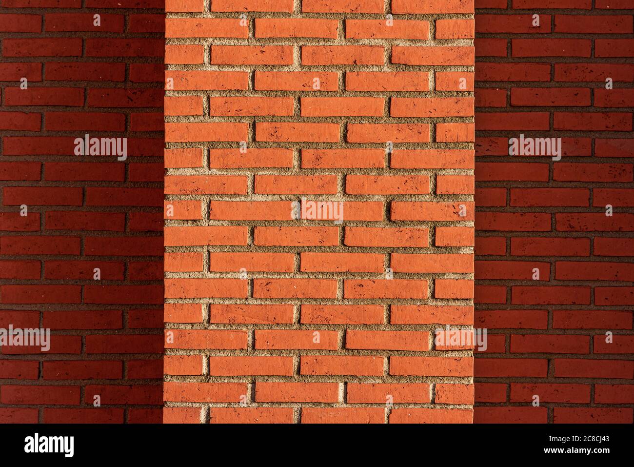 Red brick wall in sunlight Stock Photo - Alamy