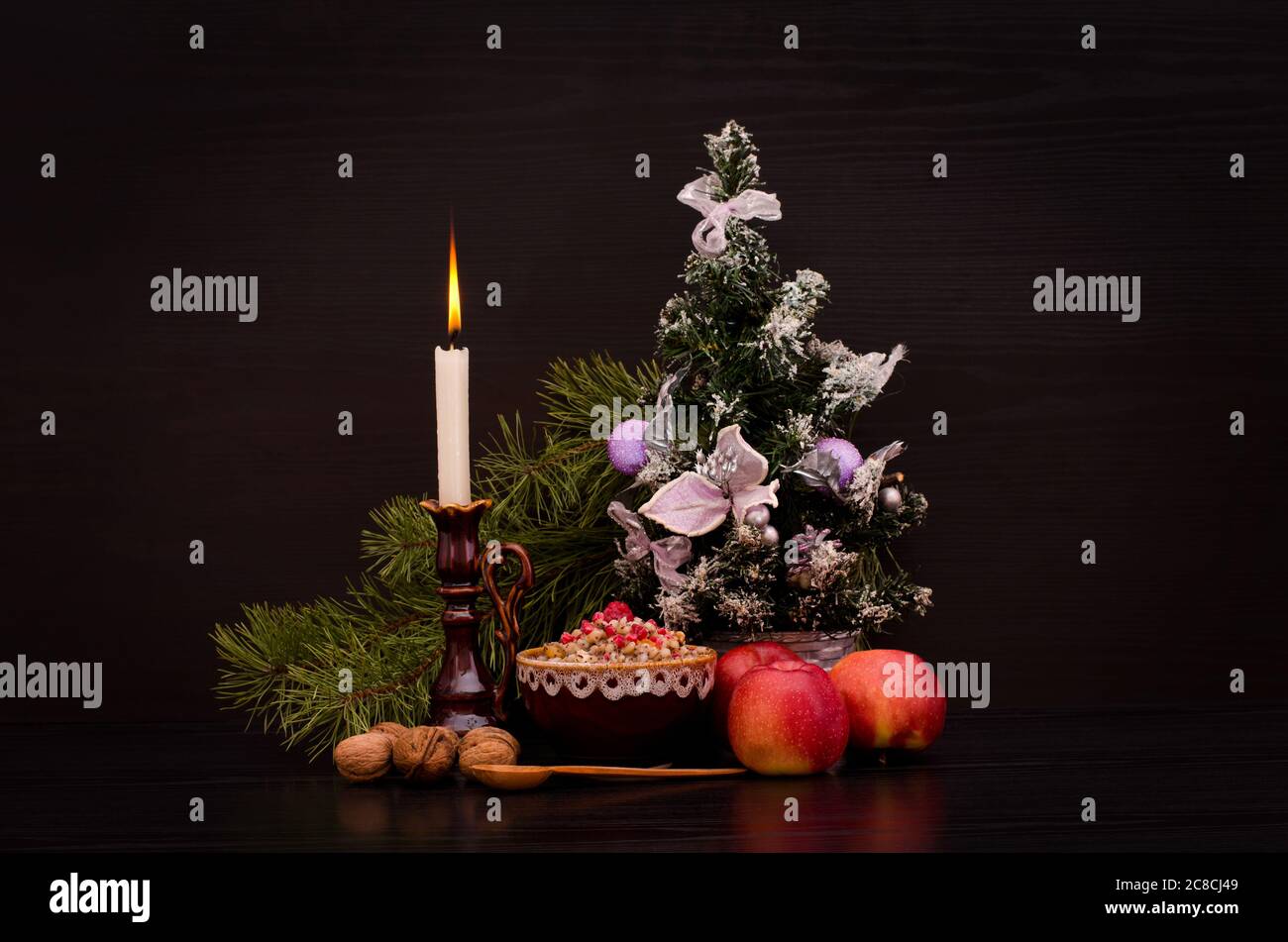 Christmas kutia Traditional Slavic sweet dish. Candle, apples and ...